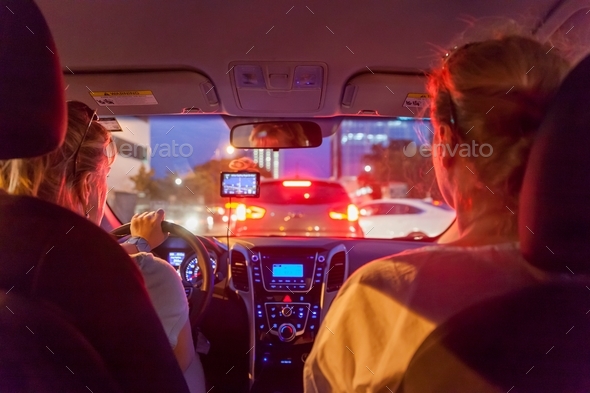 Road trip with friends, girls driving, car ride in the city Stock Photo ...