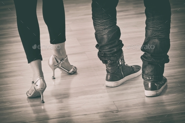 Couple dancing. Legs of female and male dancers in frame. Social ...