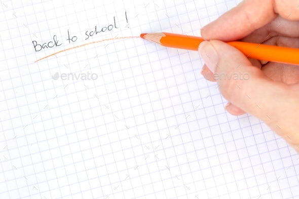 Back to school, hand drawing with colorful orange pencil. Top view ...