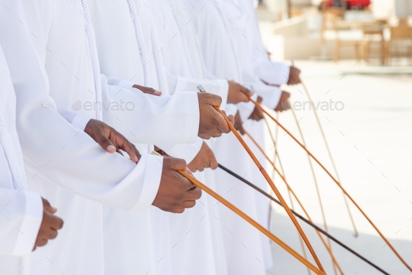 Traditional Emirati Al Ayalah male dance, UAE heritage, hands in frame ...