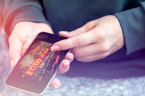 Cyber attack. Mobile phone in female hands with screen showing ...