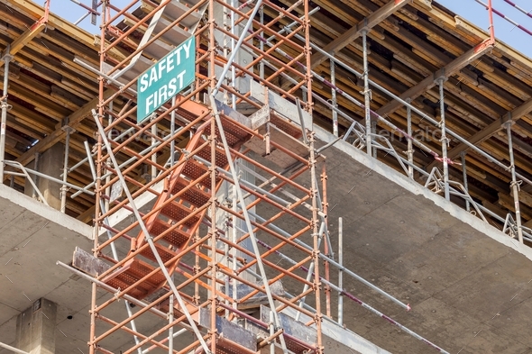 Safety first sign at the construction site Stock Photo by vinnikava
