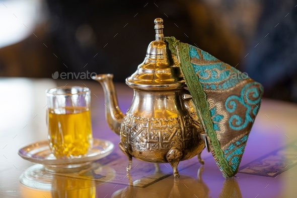 Moroccan tea at the cafe in a traditional way Stock Photo by vinnikava