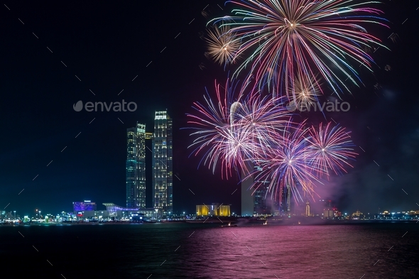 Fireworks lighting up the sky in Abu Dhabi with high rise modern ...