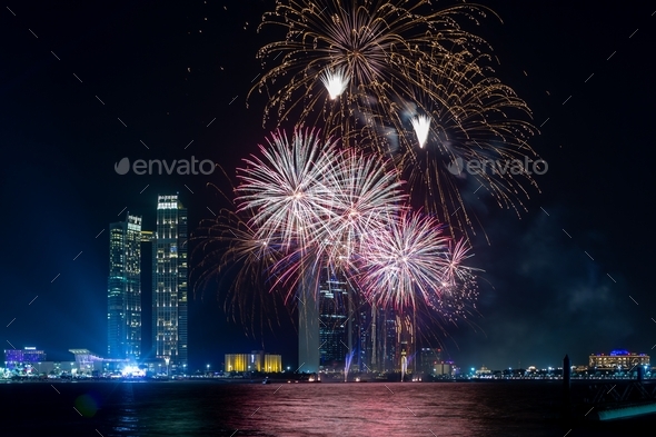 Fireworks lighting up the sky in Abu Dhabi with high rise modern ...