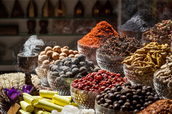 Various spices and bukhoor agar wood burner at Dubai spice market Stock ...