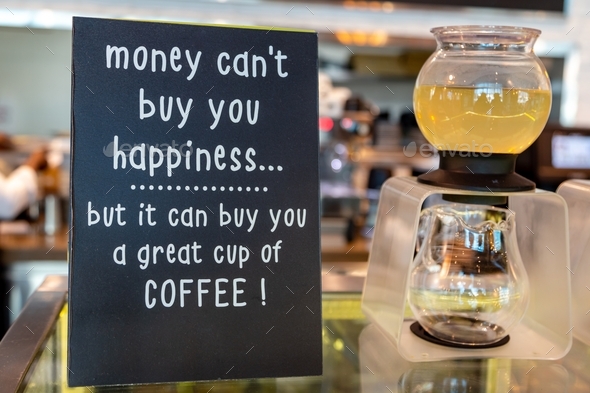 Sign at the cafe ‘Money can’t buy happiness, but it can buy you a great ...