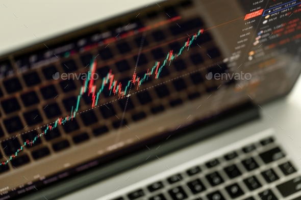 Trading chart displayed on the screen of the laptop. Stock market ...