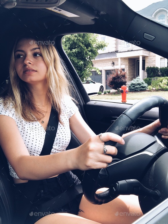 Young teenage girl is taking her first driving lessons Stock Photo by ...