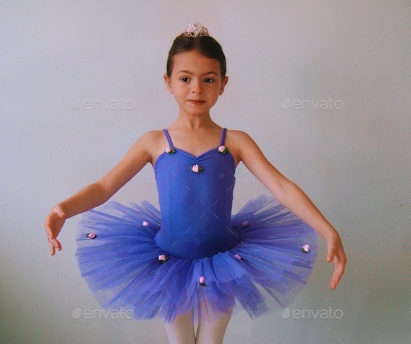 Little girl in a blue ballet tutu is posing for a picture Stock Photo ...