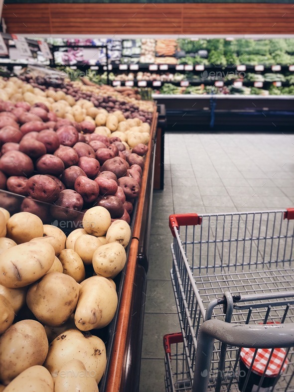 Shopping cart in a produce section of a grocery store. Shop the ...