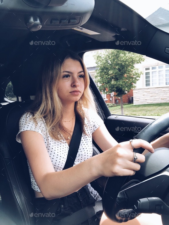 Young teenage girl is taking her first driving lessons Stock Photo by ...