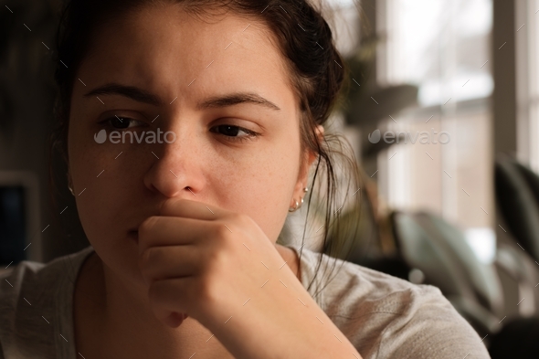 Closeup sad upset troubled teenage girl face worried concerned and deep ...