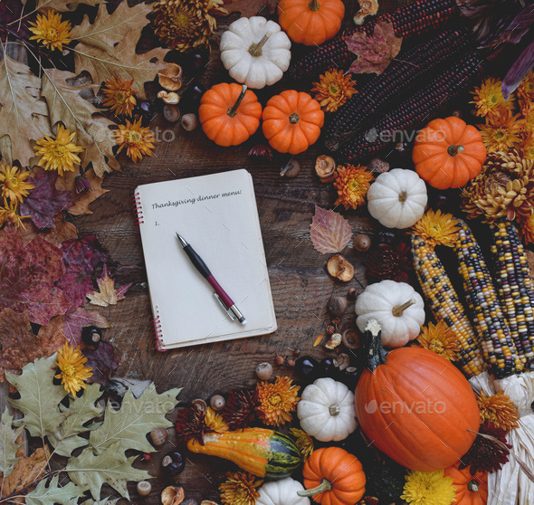 Notebook saying Thanksgiving dinner menu surrounded by fall leaves ...