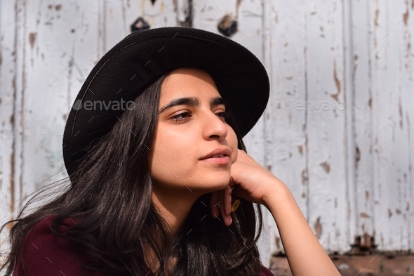 Closeup portrait of young girl in fedora hat with beautiful natural ...