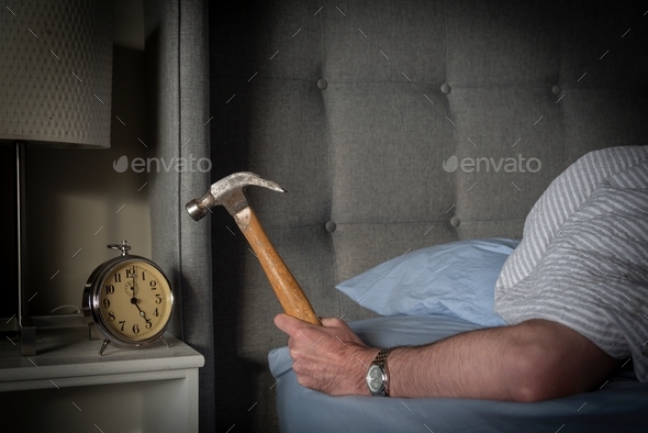 Person sleeping about to smash alarm clock with a hammer. Stock Photo ...