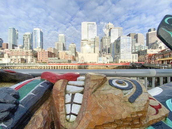 Seattle skyline viewed from waterfront with a Native American totem ...