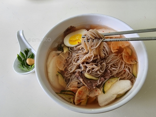 Buckwheat noodles in cold beef broth served with slices of roast beef ...