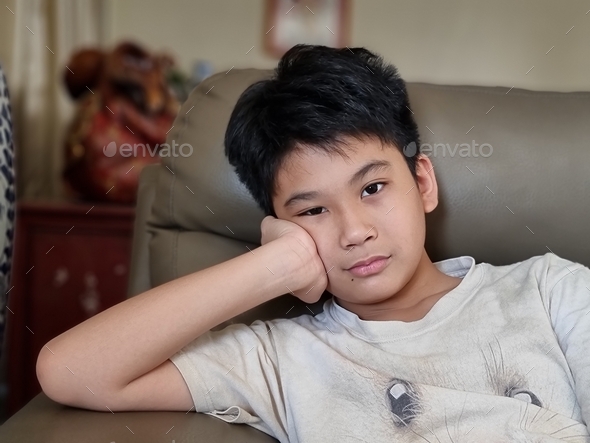 Portrait of an Asian gen z feeling bored Stock Photo by weewendy ...