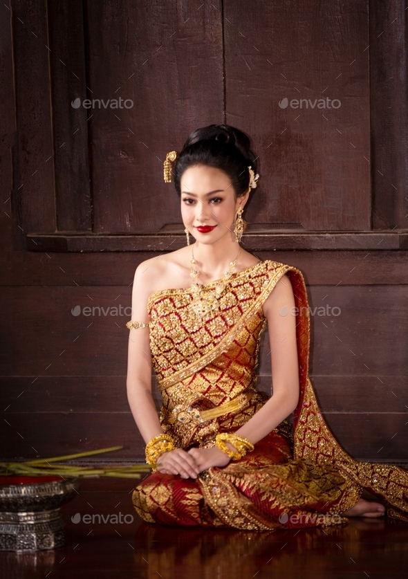 Asia woman wearing traditional Thai dress, The costume of the national dress of ancient Thailand ...