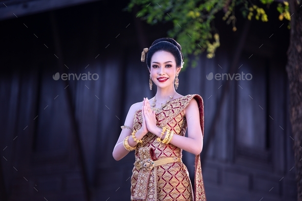 Asia woman wearing traditional Thai dress, The costume of the national dress of ancient Thailand ...