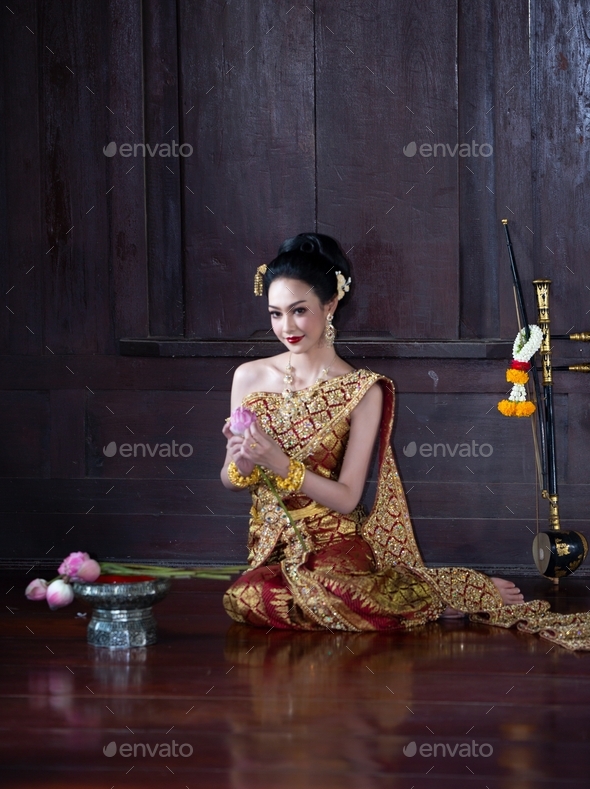 Asia woman wearing traditional Thai dress, The costume of the national dress of ancient Thailand ...