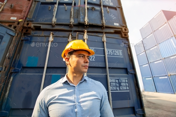 Foreman control loading Containers box from Cargo freight ship for ...