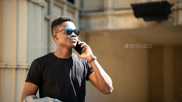 Young smiling attractive black man lifestyle portrait. Stock Photo by ...