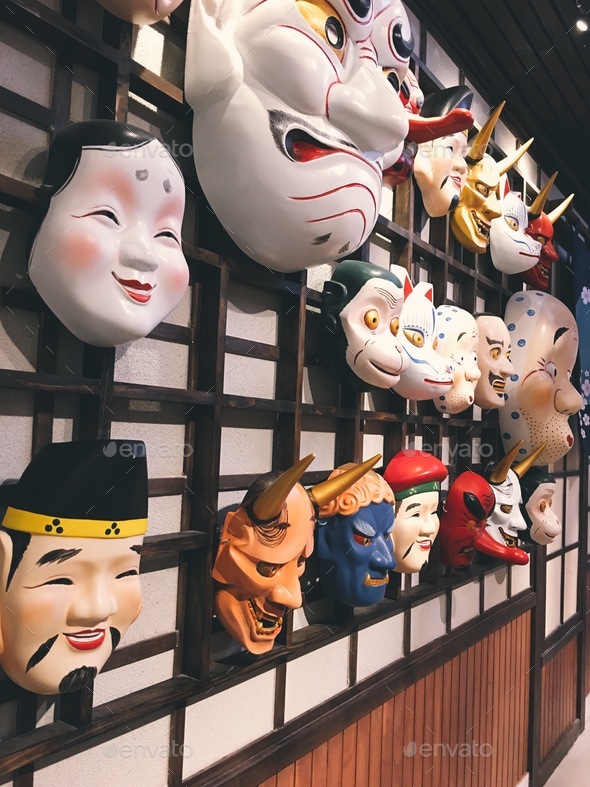 variety traditional Japanese masks on the wall Stock Photo by Jsttanrak