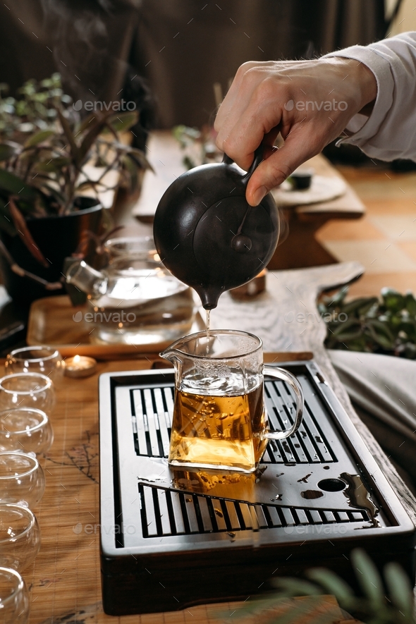 Traditional tea ceremony - pouring chinese oolong in glass cup Stock ...