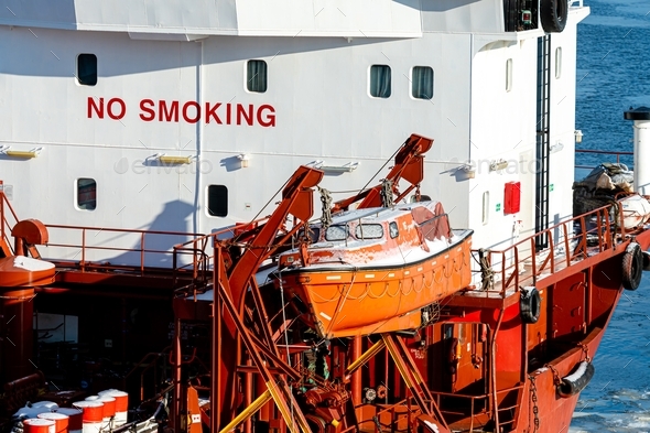 cargo vessel emergency safety rescue boat on deck, closeup Stock Photo ...