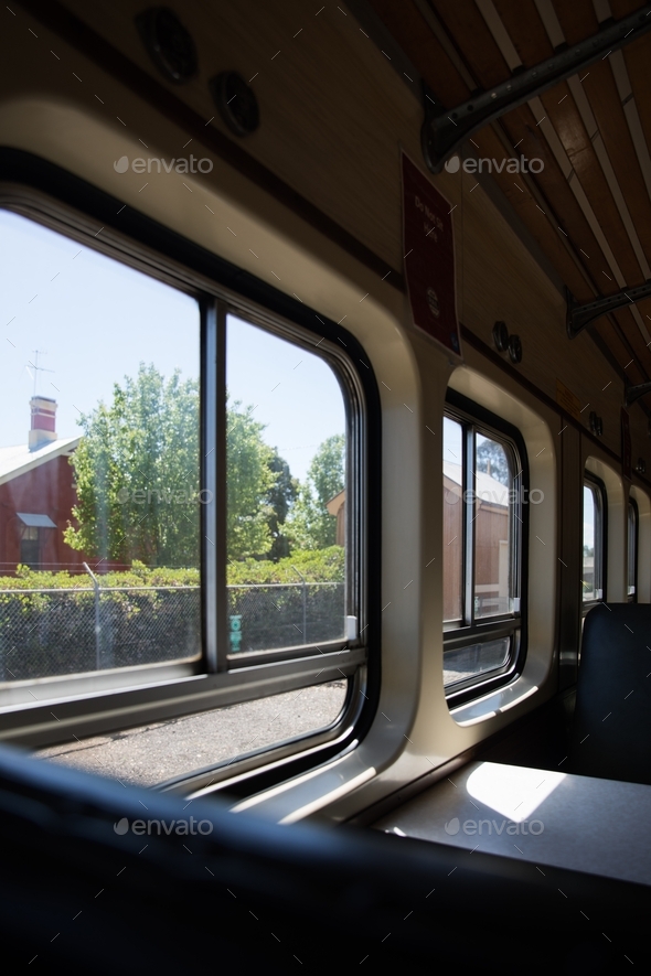 Interior of train carriage looking out a window casting shadows Stock ...