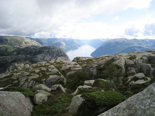 View from the top of a rock cliff overlooking a fjord in Norway, Stock ...