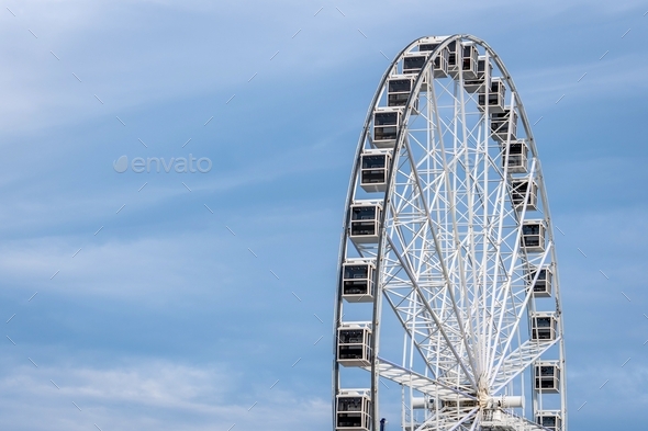 Panoramic wheel on a light blue sky background Stock Photo by ...