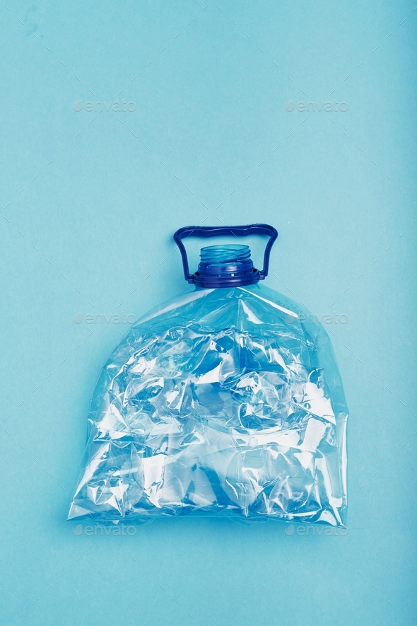 Plastic waste. Squashed bottles for recycling. Background. Too many ...