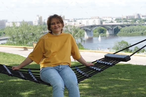 female portrait. girl of European appearance in summer in a yellow T ...