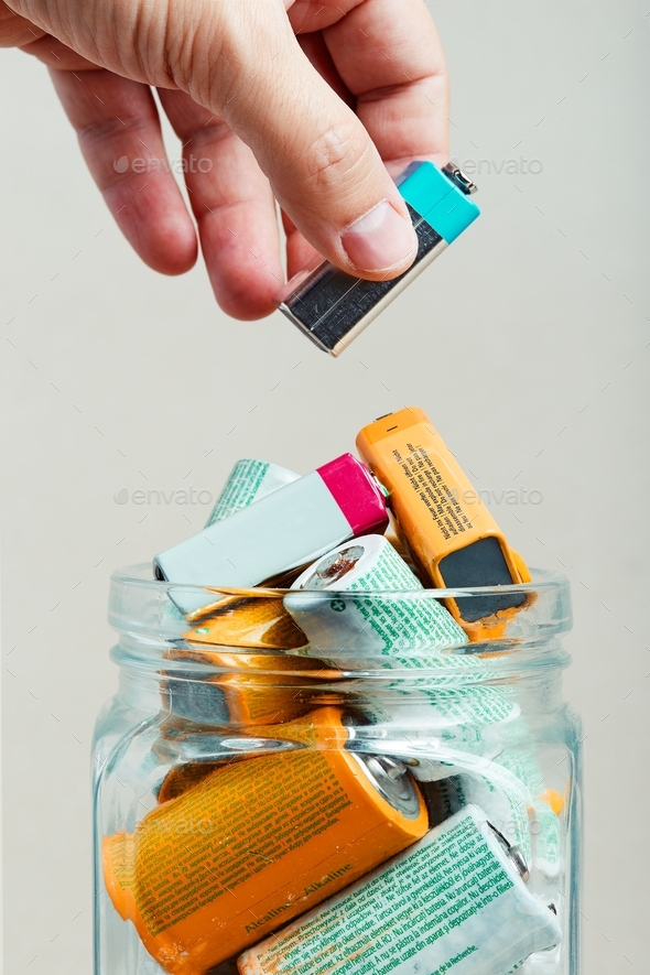 Discharged batteries in cardboard box. Collecting used batteries to ...