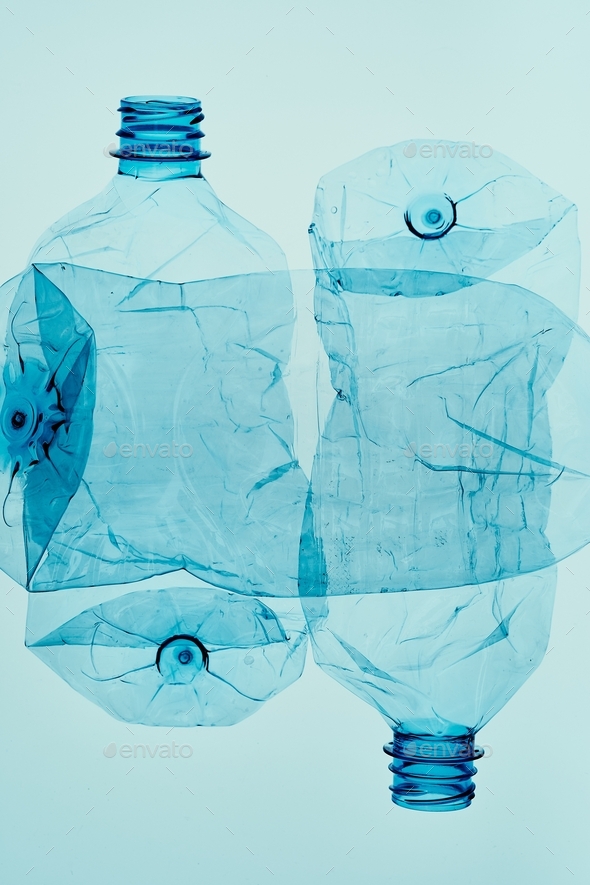 Plastic waste. Squashed bottles for recycling. Background. Too many ...