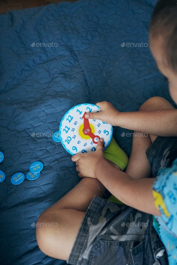 Kids learning how to tell time from clock and set the hands in the ...