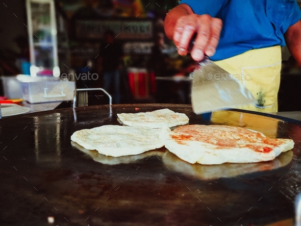 Making of Roti Canai or Roti Prata famous Indian margarine flatbread in ...