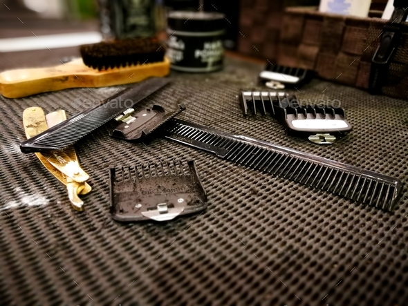 barber shop tools on the table. messy equipments Stock Photo by ellinnur