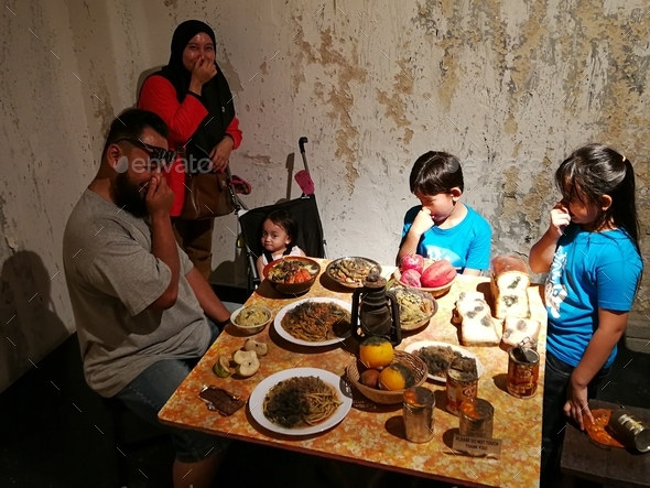 family closing nose at the dirty dining table with rotten foods Stock ...