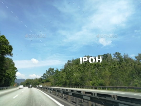 ipoh road sign next to the highway Stock Photo by ellinnur | PhotoDune