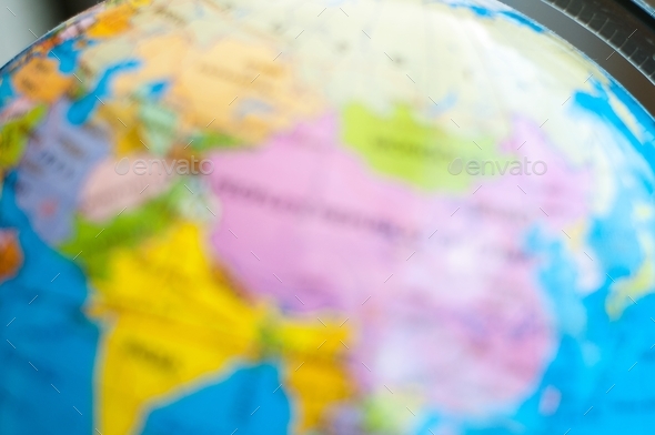 Blurry photo of maps on the globe. Stock Photo by ellinnur | PhotoDune
