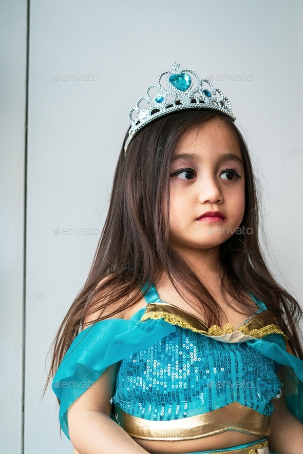 Portrait of a little girl dressed in Arabian princess costume against ...