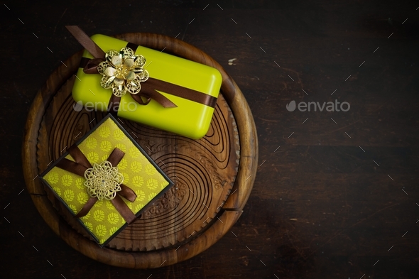 yellow songket box wrapped in ribbon on traditional handcrafted ...
