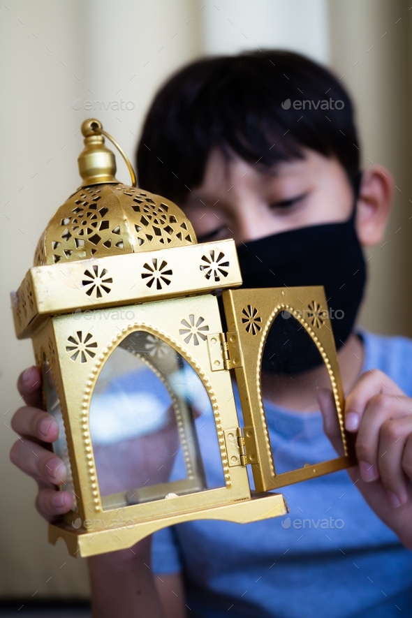 Islamic design lantern with boy in face mask. eid mubarak Aidilfitri ...