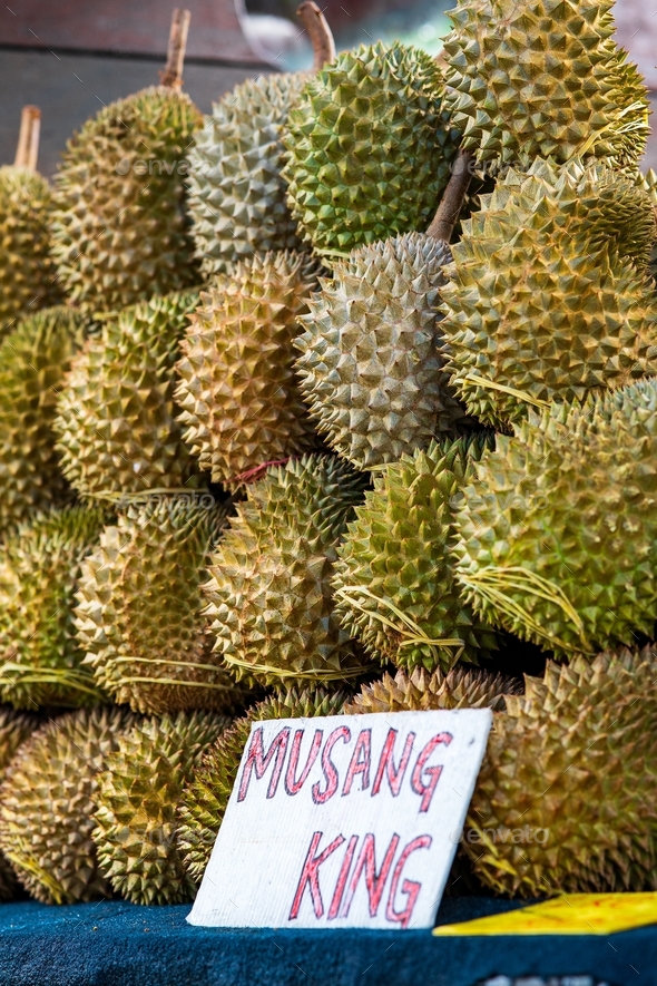 Musang King durian selling at the fruit stall. Stock Photo by ellinnur