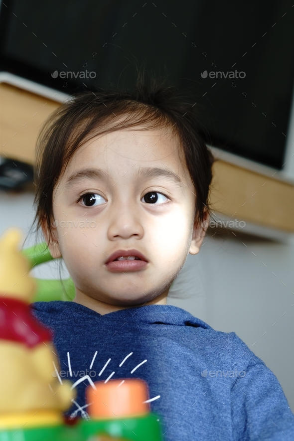 portrait of cute little girl, low angle view Stock Photo by ellinnur