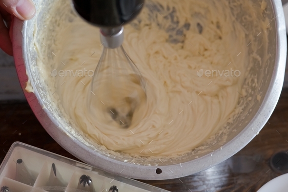beating butter into cream in a mixing bowl. making cake Stock Photo by ...